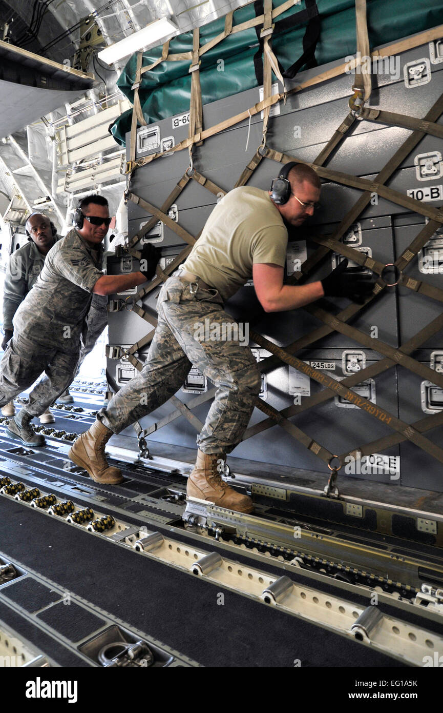 Airmen from the 89th Aerial Port Squadron load pallets onto a U.S. Air ...