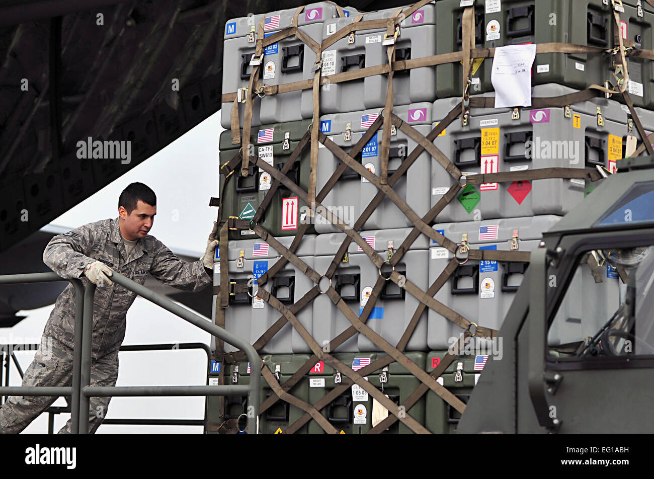 U.S. Air Force Staff Sgt. James Anderson offloads pallets of ...