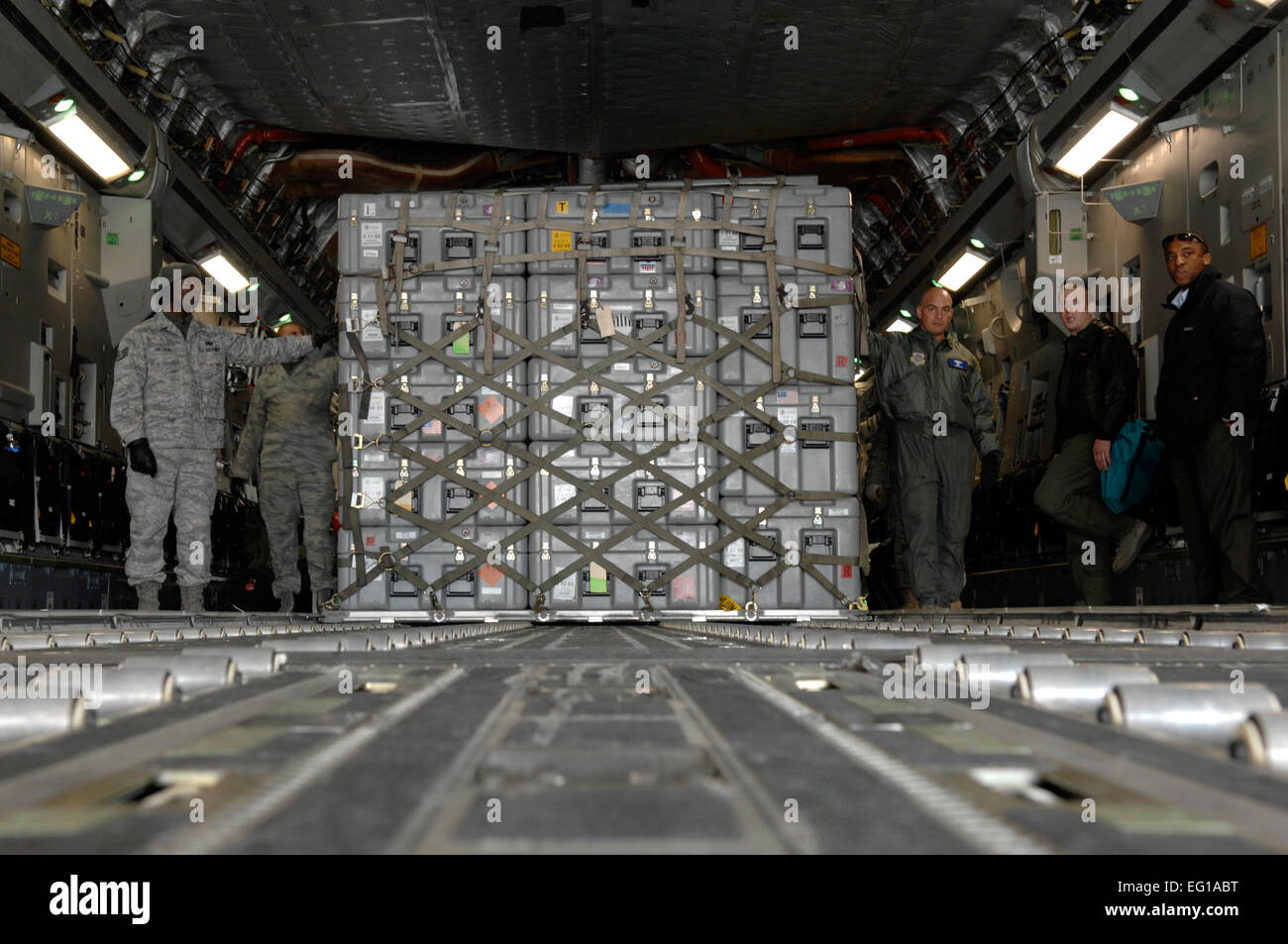 U.S. Air Force Airmen offload pallets from a Los Angeles Search and ...