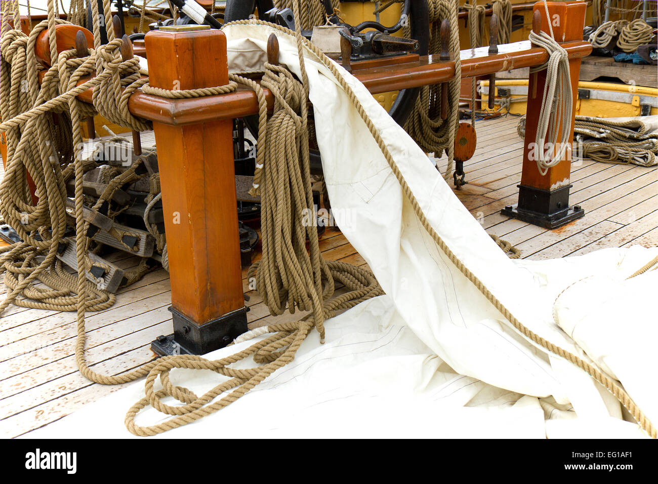 Deck of old sailing ship with ropes and sail cloth Stock Photo - Alamy