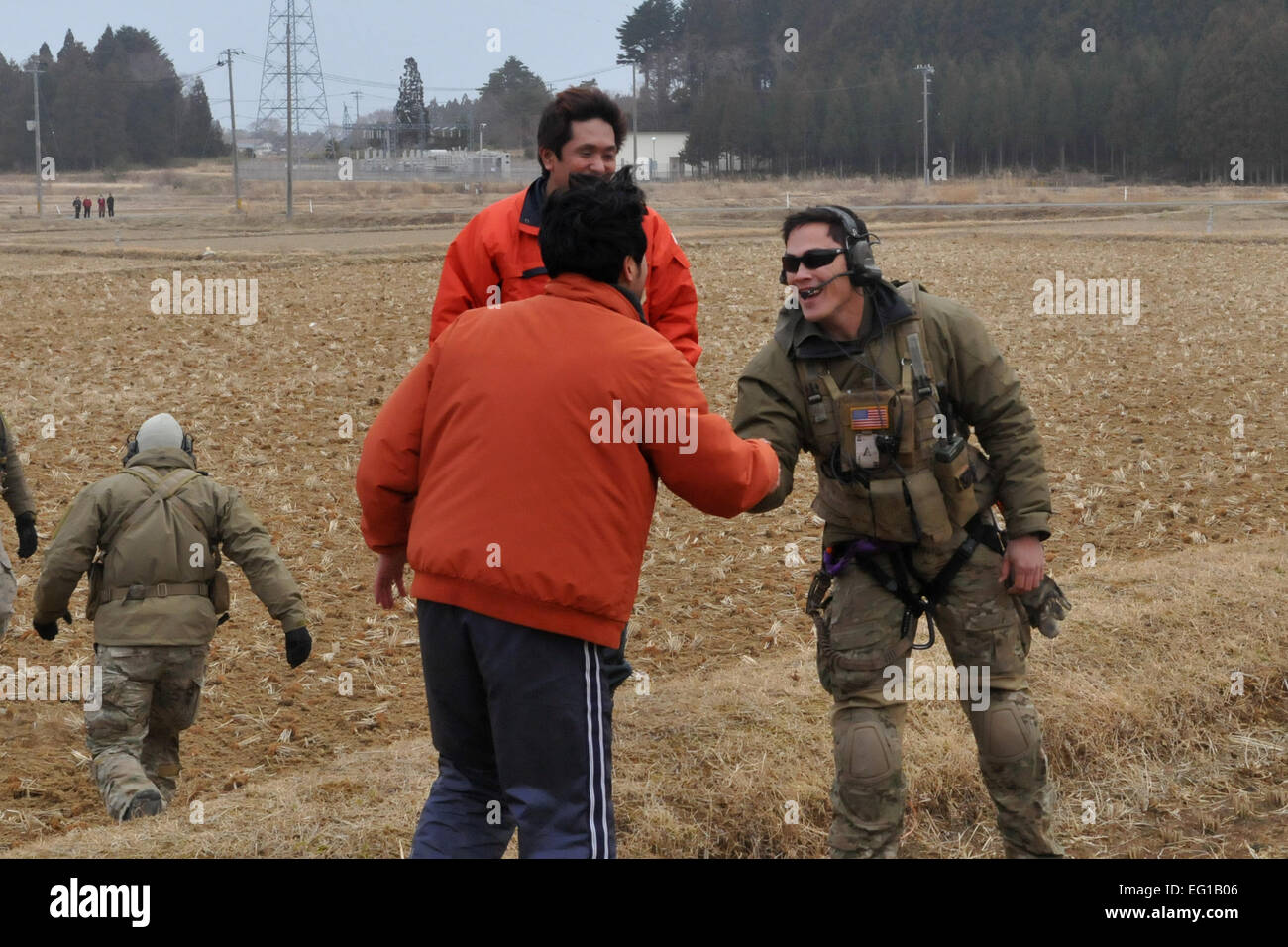 A Japanese relief worker shows his appreciation to a U.S. service ...