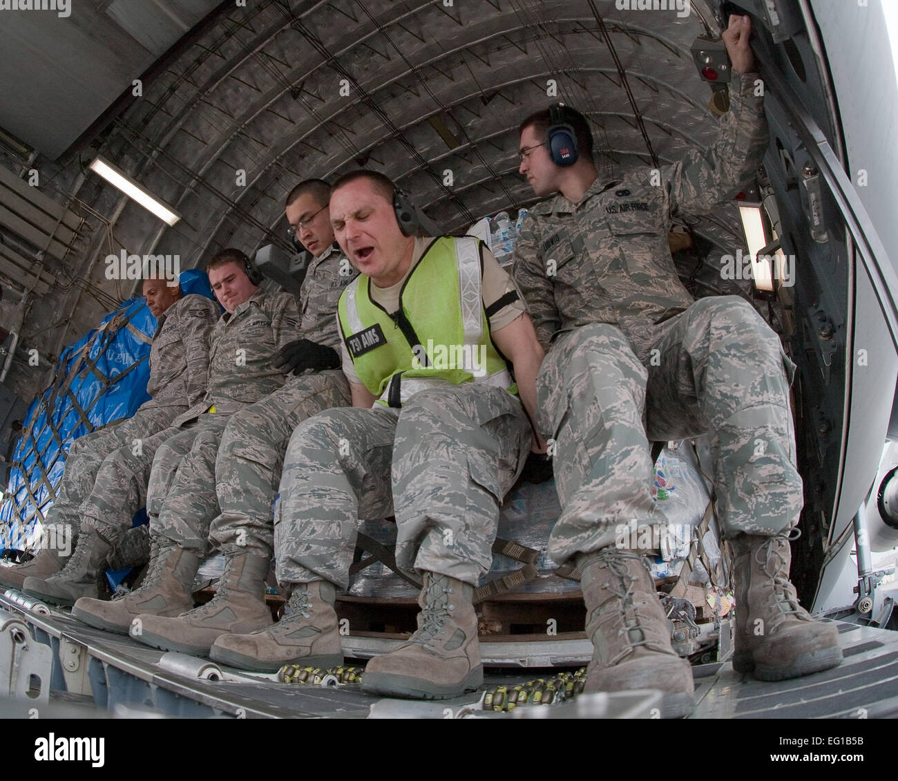 YOKOTA AIR BASE, Japan -- 730th Air Mobility Squadron members load ten ...