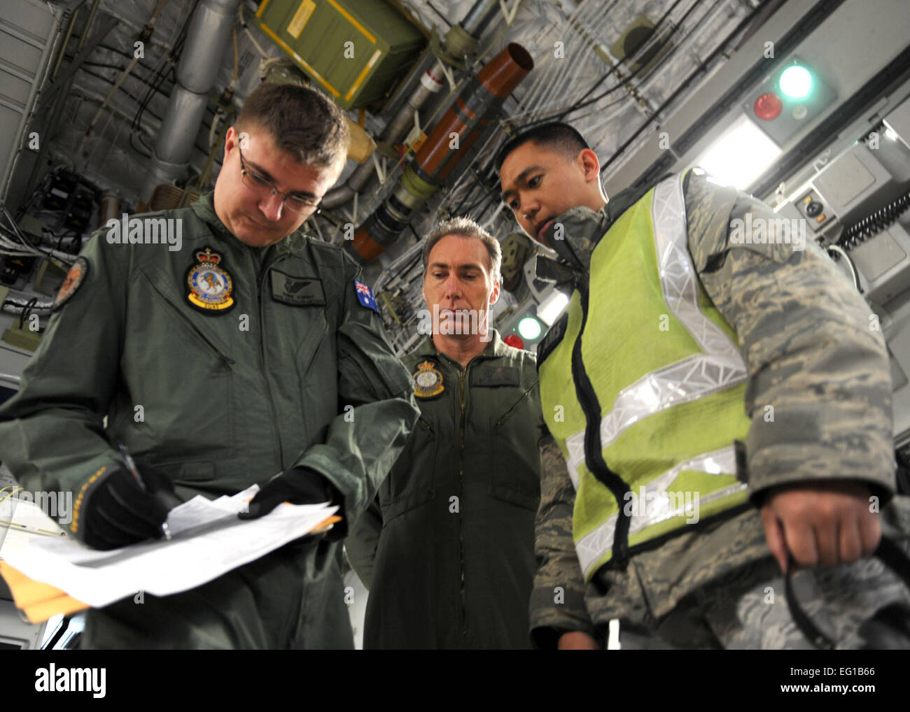 YOKOTA AIR BASE, Japan -- Staff Sgt. Nathaniel Olaguer right oversees a ...