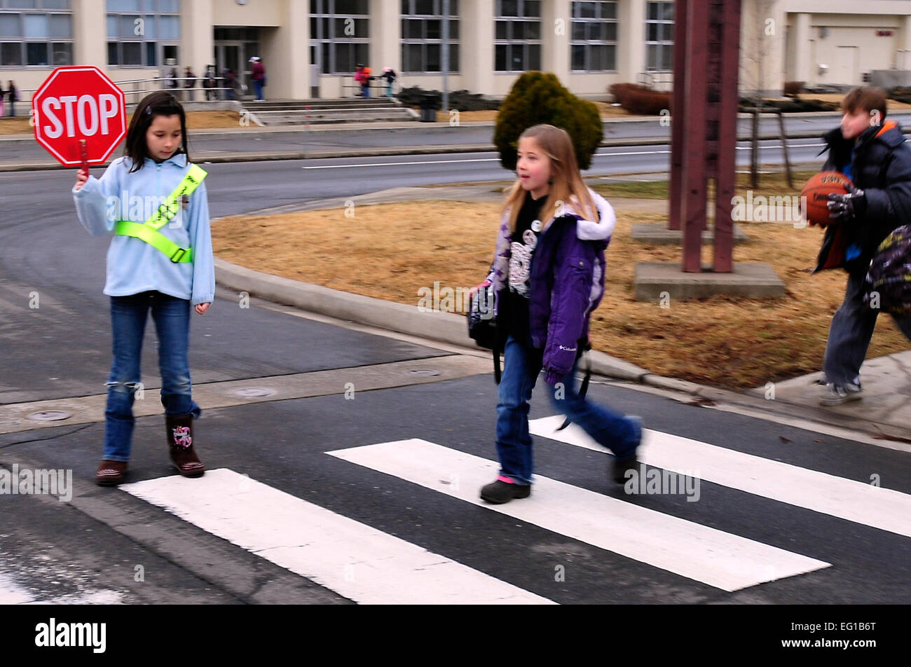 Ten-year-old Samantha Browning, safety patrol, stops traffic to allow ...
