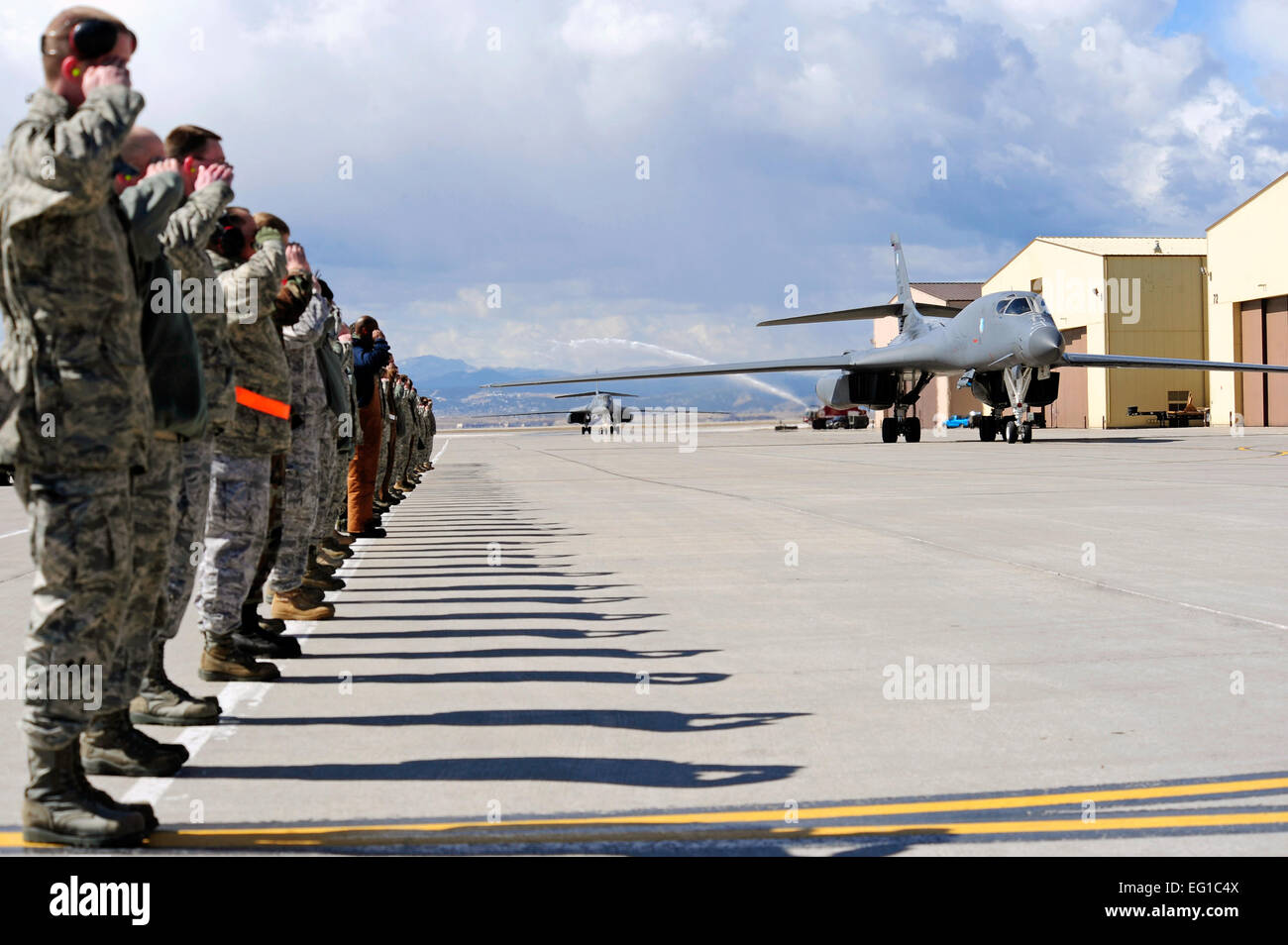 Airmen from the 28th Bomb Wing salute two returning B-1B Lancers as ...