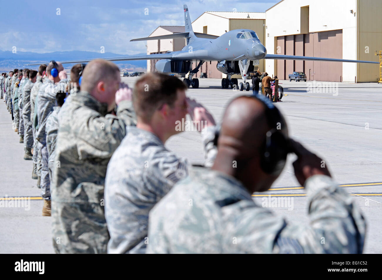 Airmen from the 28th Bomb Wing salute two returning B-1B Lancers as ...