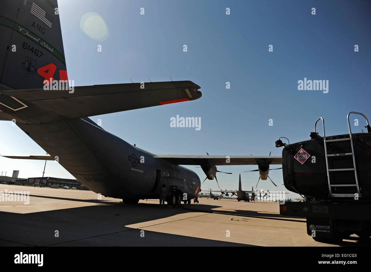 Airmen refuel an Air Force C-130J Hercules cargo aircraft from the ...