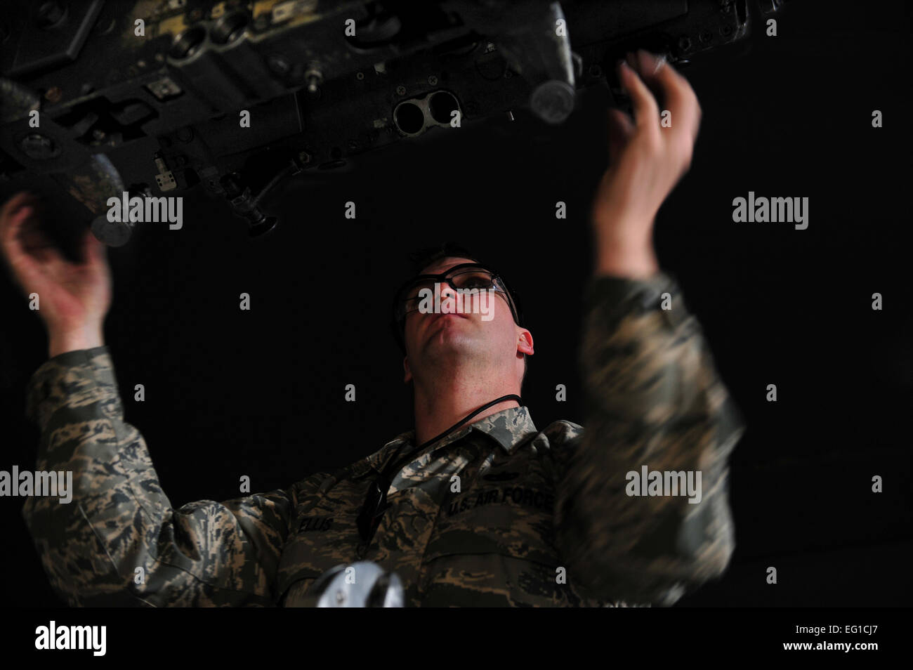 A U.S. Air Force bomb loader technician assigned to the 5th Aircraft ...