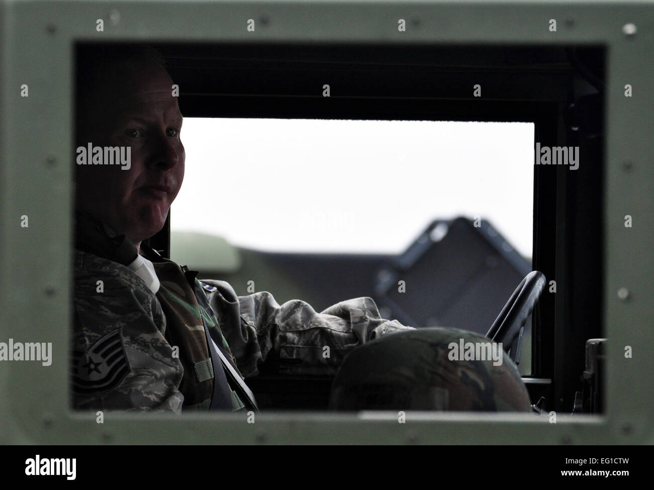A U.S. Air Force Airman waits in a Humvee after a tactical convoy ...