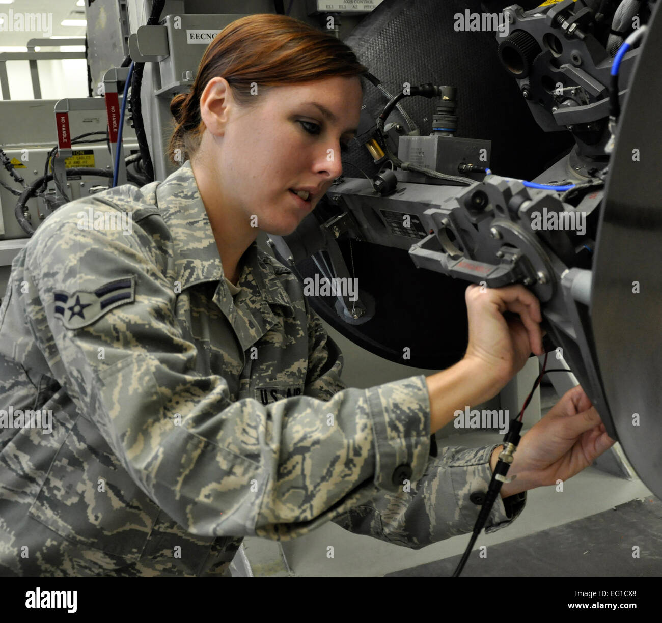 U.S. Air Force Airman 1st Class Ashley Taylor checks the signals on a ...