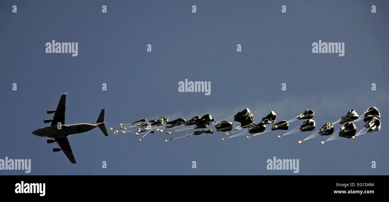 A U.S. Air Force Globemaster III airdrops supplies on Forward Operating ...