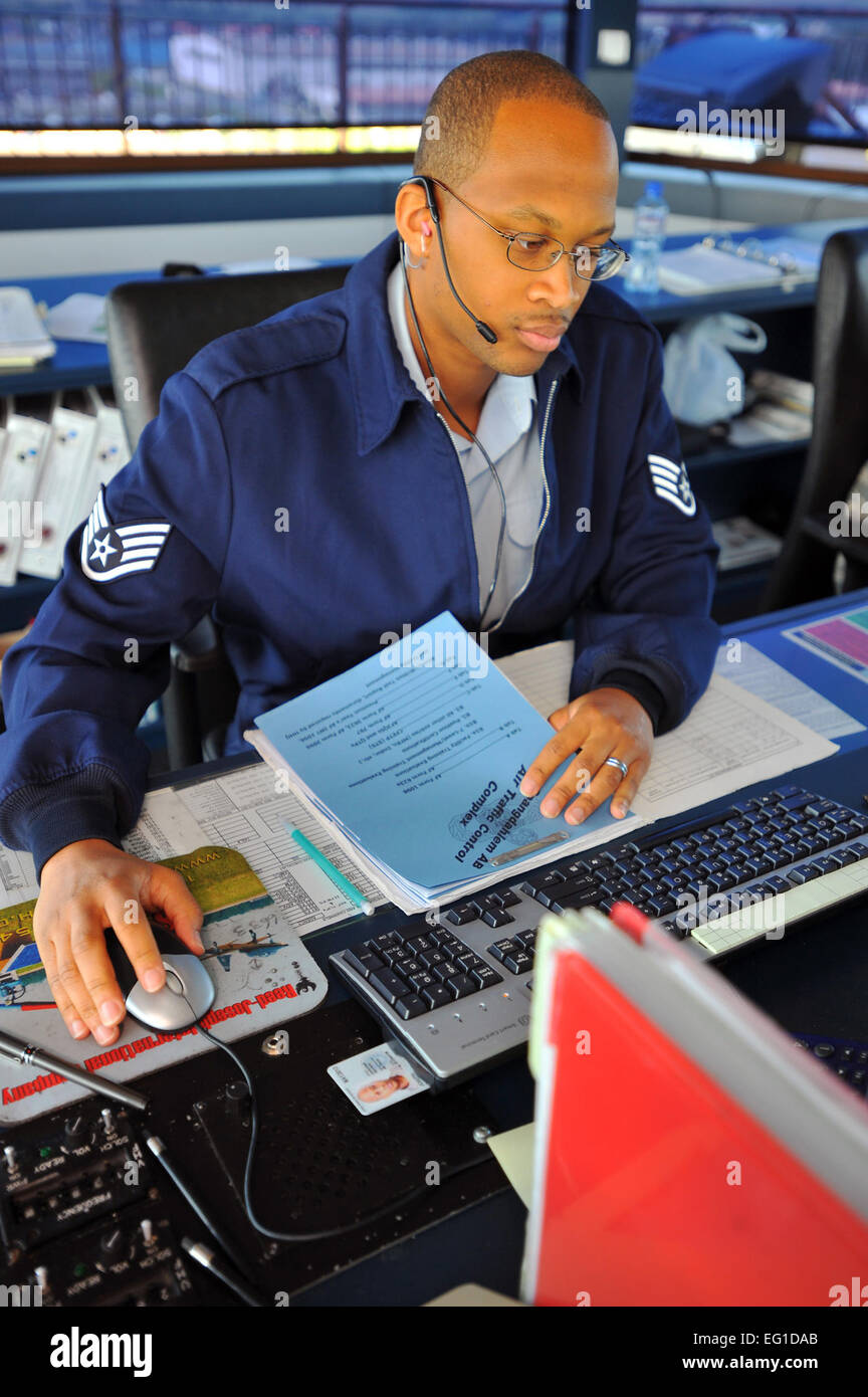 U.S. Air Force Staff Sgt. Reginald Joseph fills out forms and ...