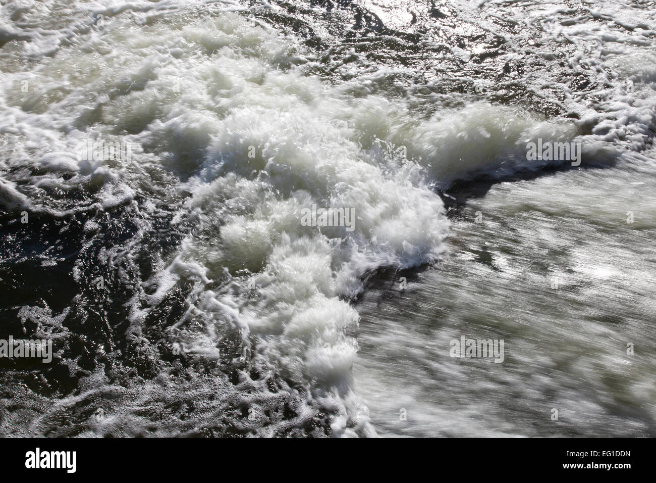Racing water in turmoil Stock Photo - Alamy