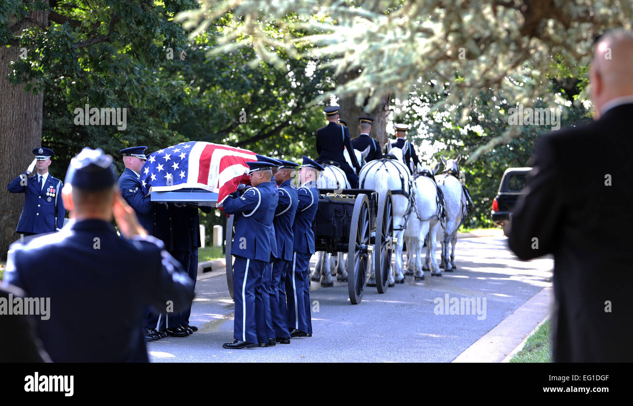 Members of the U.S. Air Force Honor Guard prepare to position the casket of retired Air Force ...
