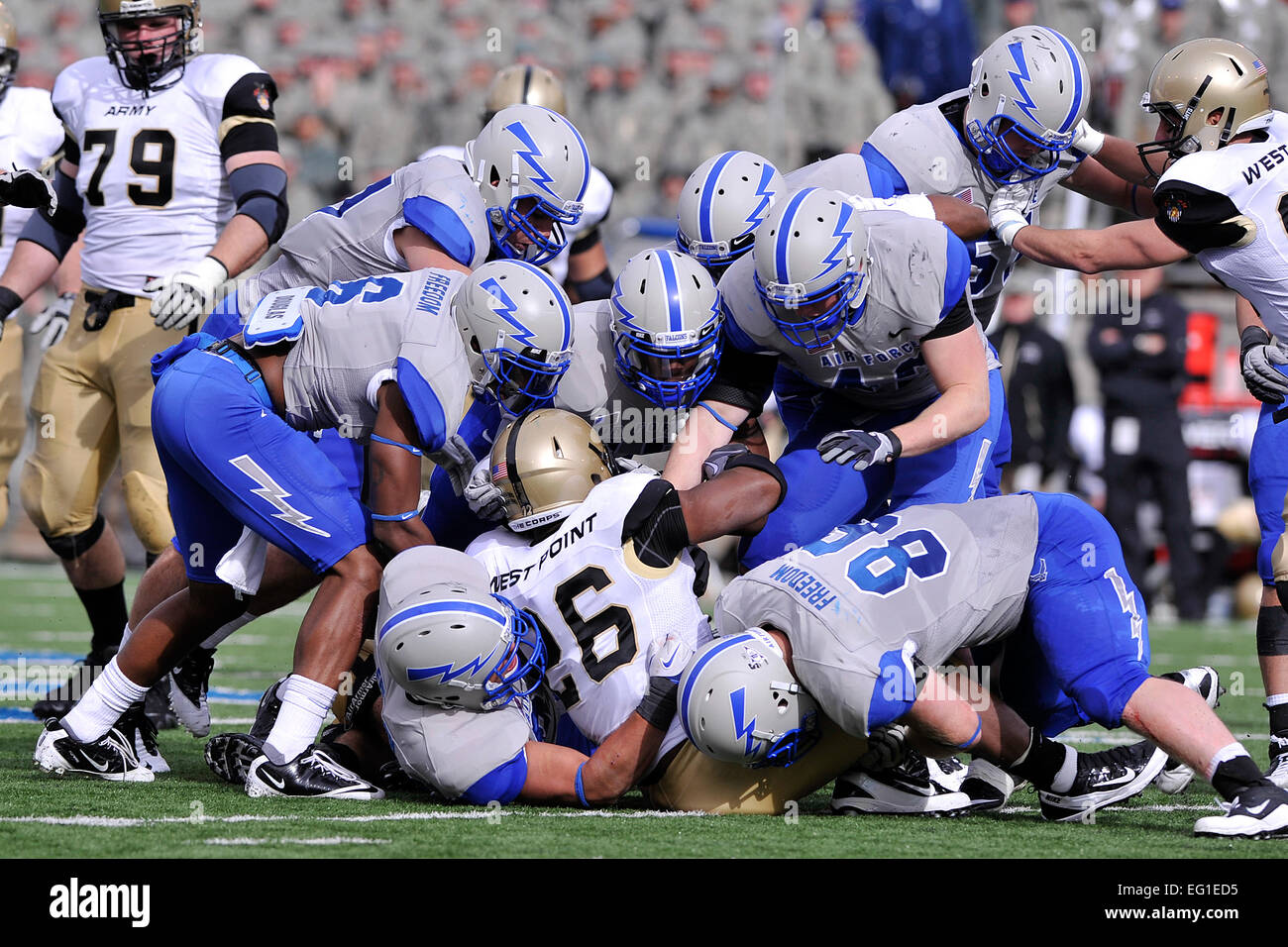 Air Force Falcon defenders swarm Black Knights running back Larry Dixon ...