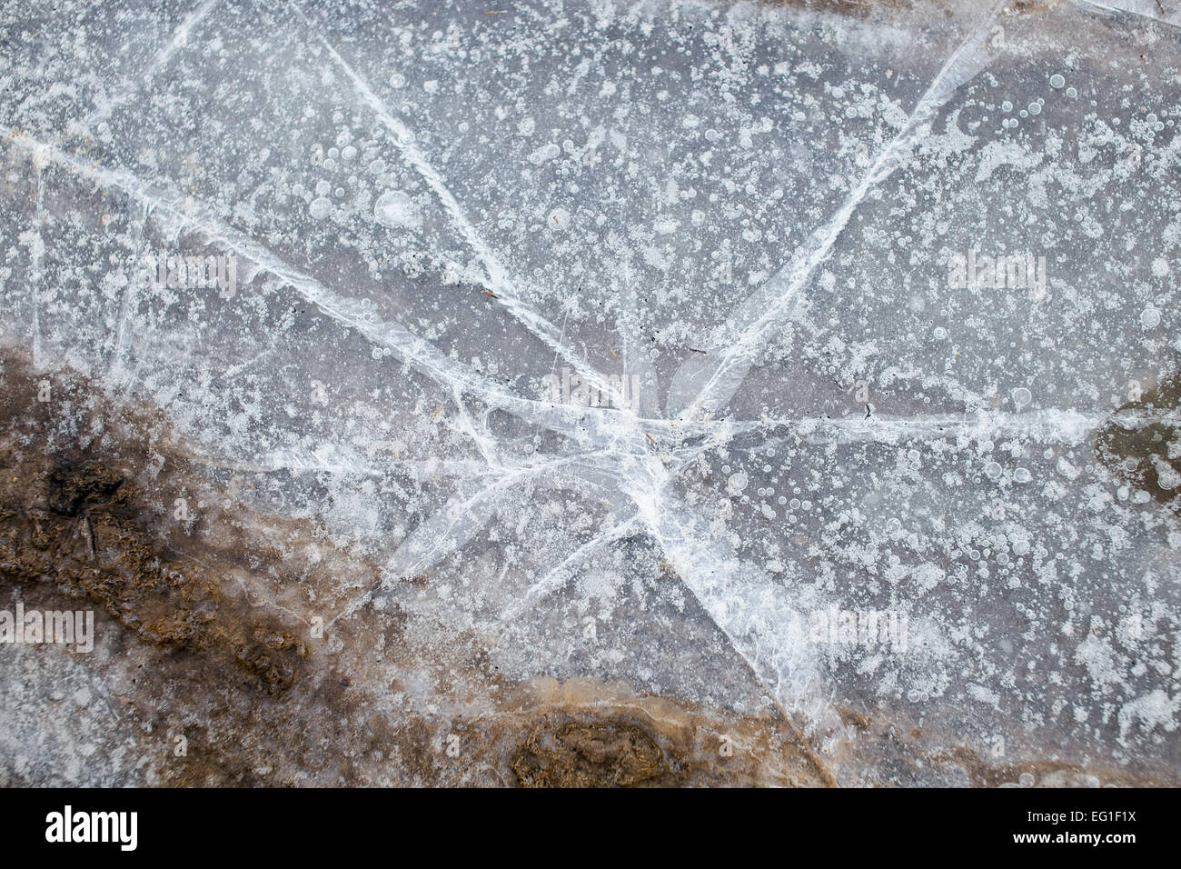 Broken ice on the road Stock Photo - Alamy