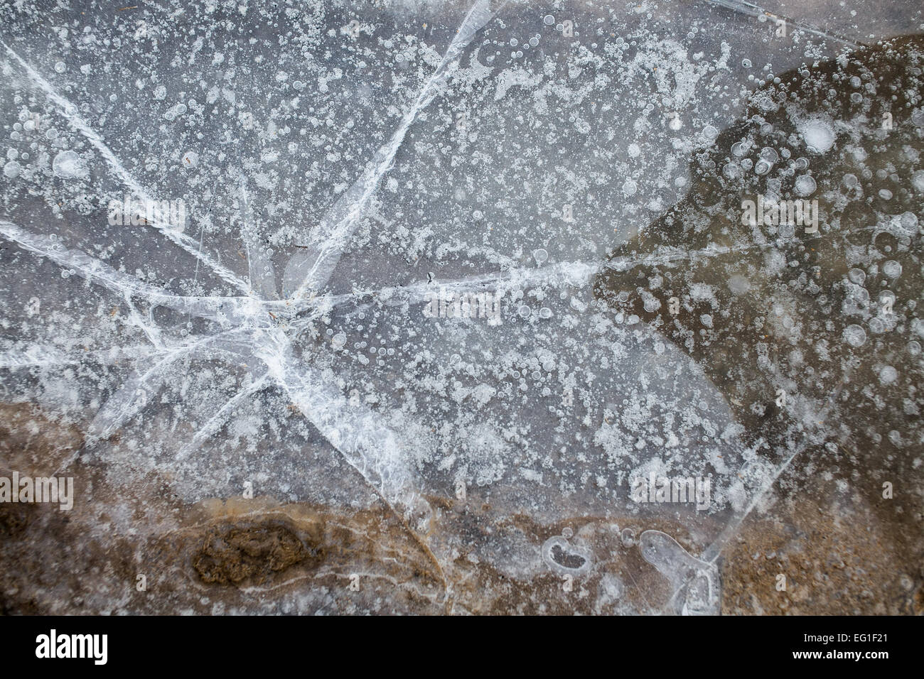 Broken ice on the road Stock Photo - Alamy
