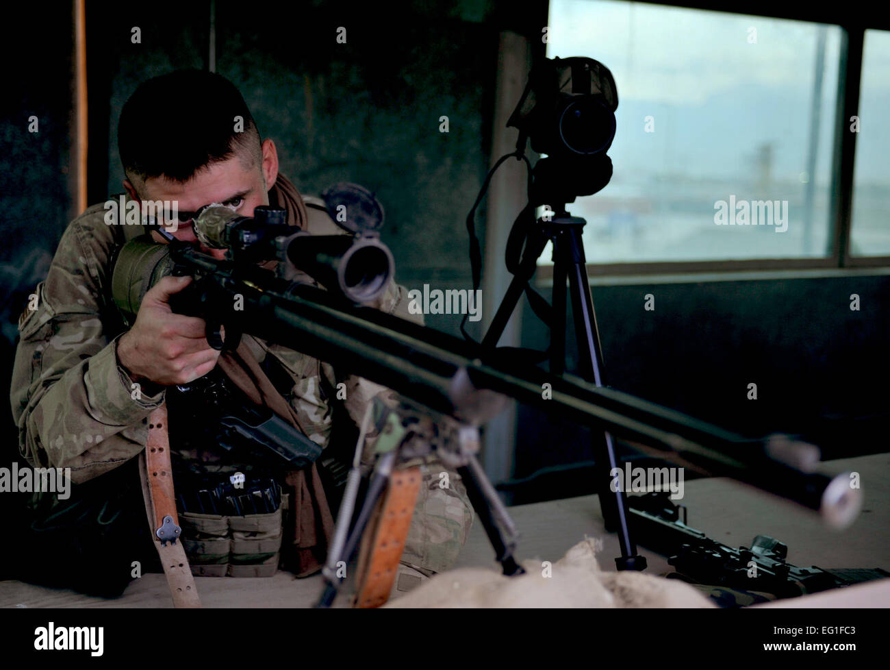 U.S. Air Force Staff Sgt. David Schwartz looks down the barrel of an M ...