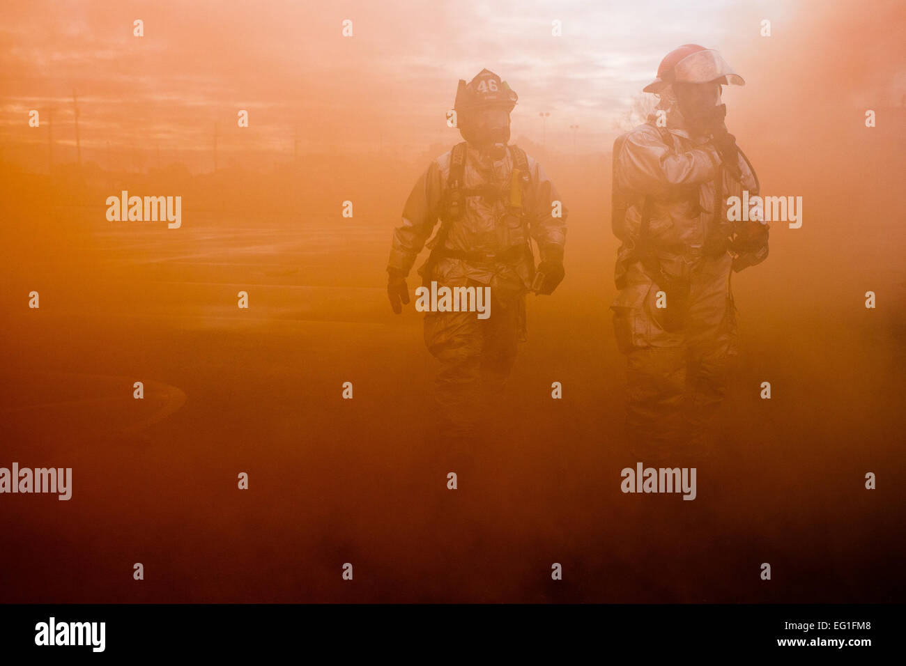 Airmen and firefighters assess the scene of a simulated bombing during ...