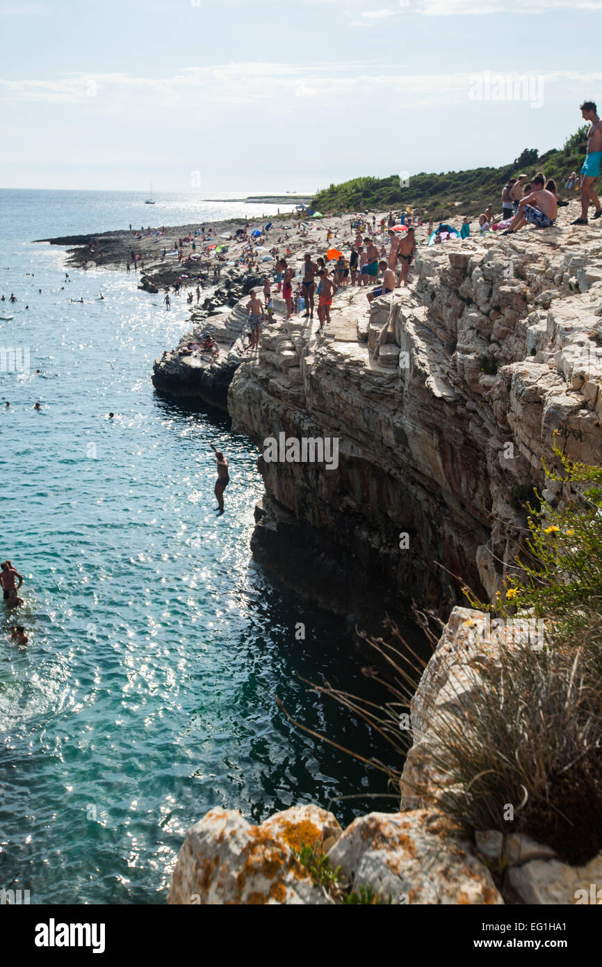 Jumping from a cliff in Croatia Stock Photo - Alamy