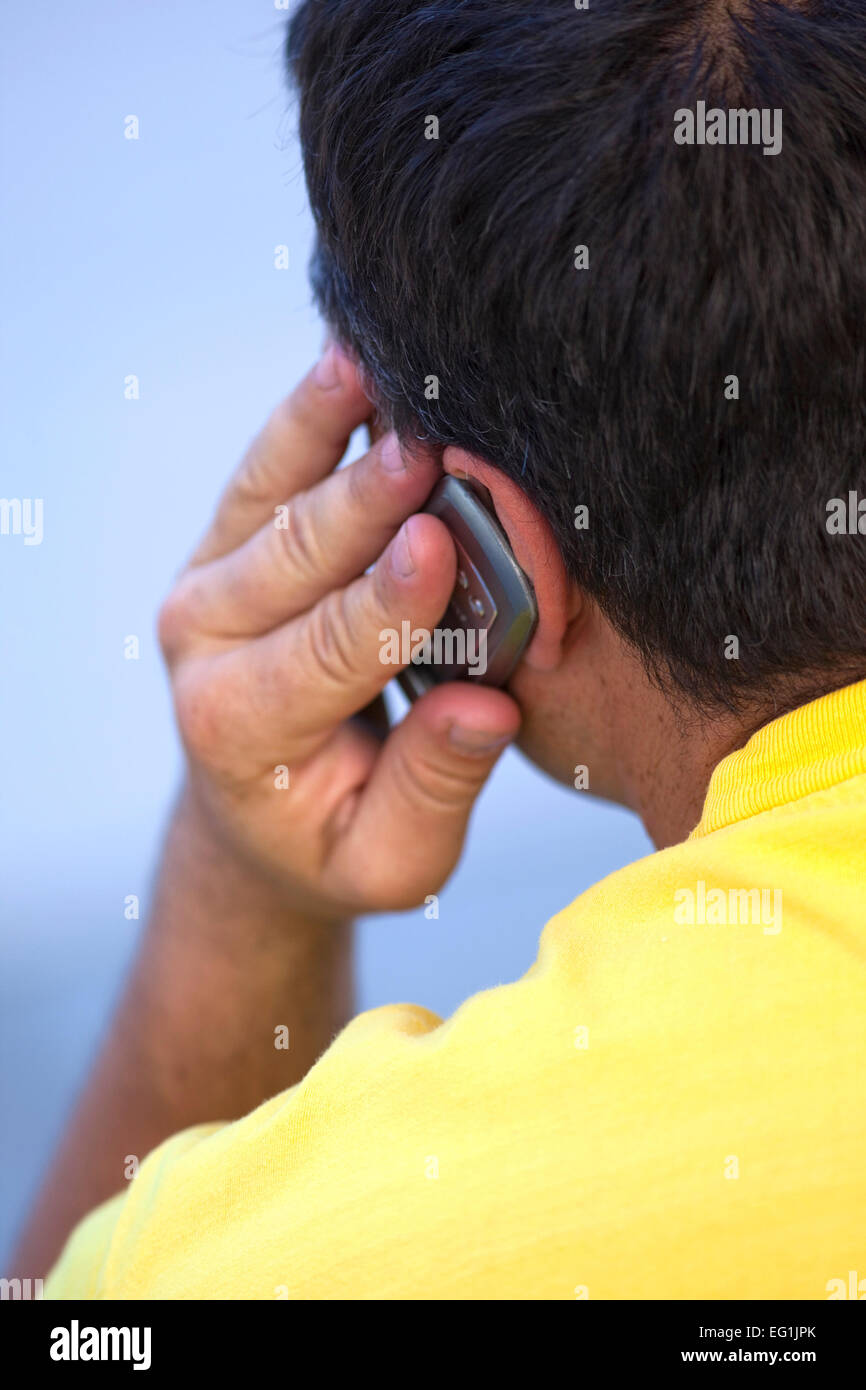 Focus on a man holding his mobile phone Stock Photo - Alamy
