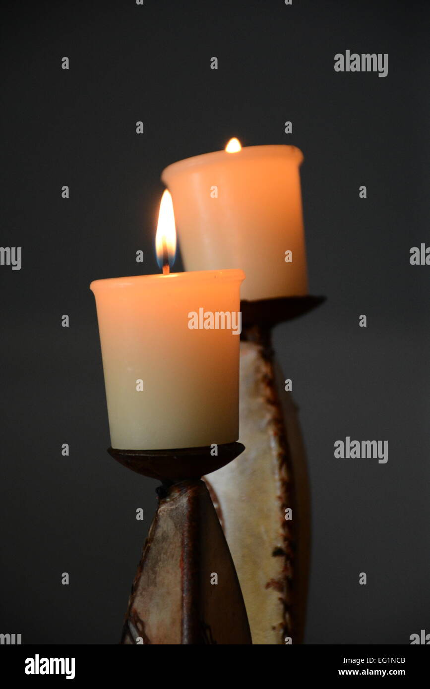 Two burning candles Stock Photo - Alamy