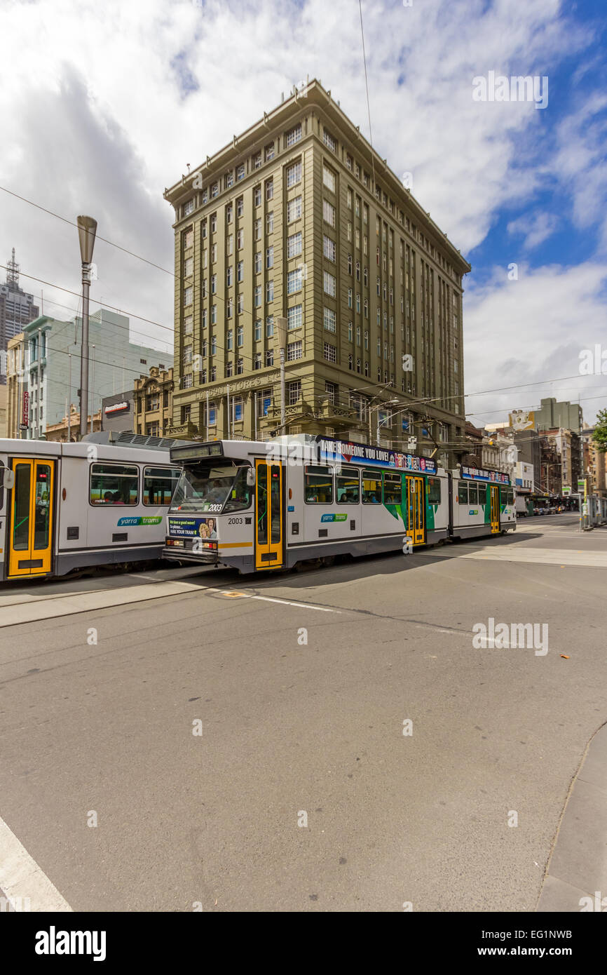 Melbourne trams pass at intersection Stock Photo - Alamy