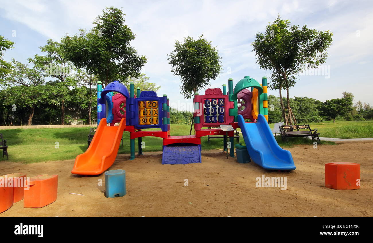 Colorful children playground in the park Stock Photo - Alamy