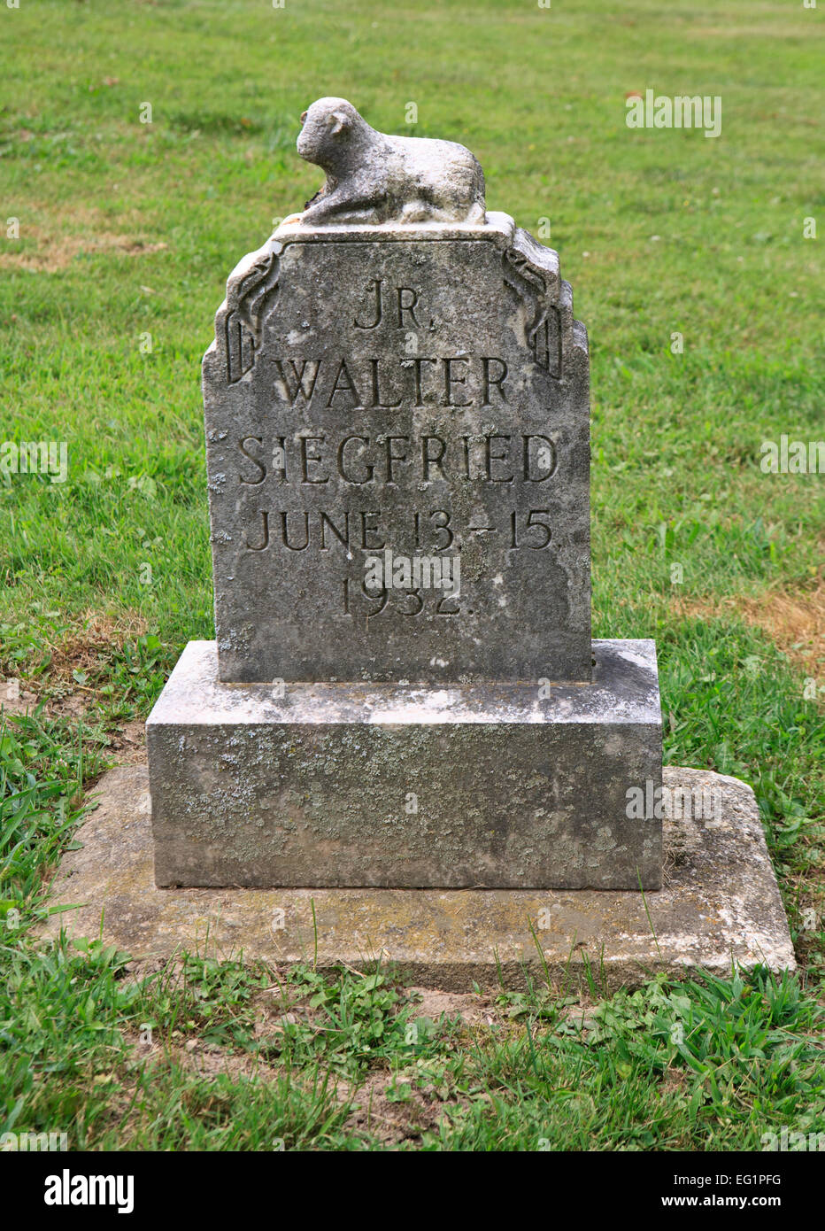 Grave marker of a child, with the symbol of a lamb on the top of the ...