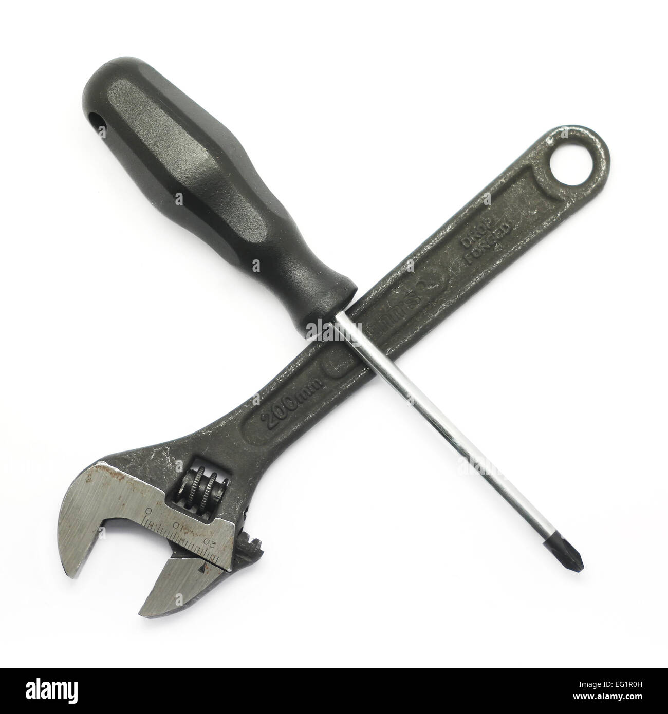 Screwdriver and adjustable wrench isolated on white background Stock ...