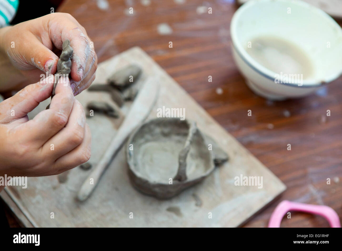 Children making pottery in a workshop at school Stock Photo - Alamy