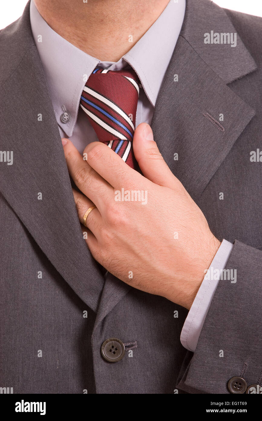 Business man fixing his tie, isolated over white Stock Photo - Alamy