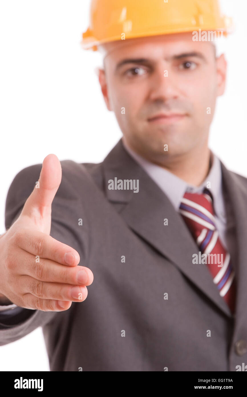 Engineer with yellow hat, offering handshake - focus on hand Stock ...