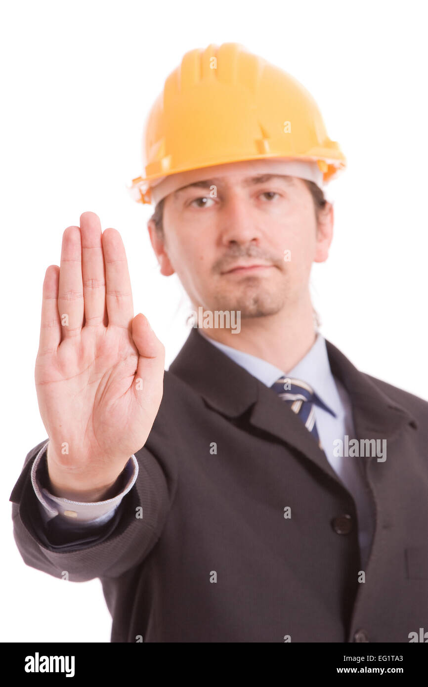 Engineer with yellow hat making stop sign - focus on hand Stock Photo ...