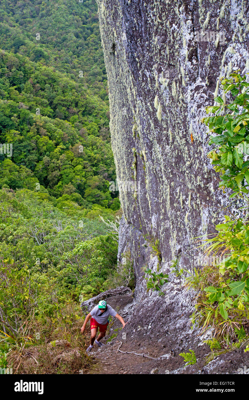 Man scrambling on the slopes of the mountain known as the Needle Stock ...