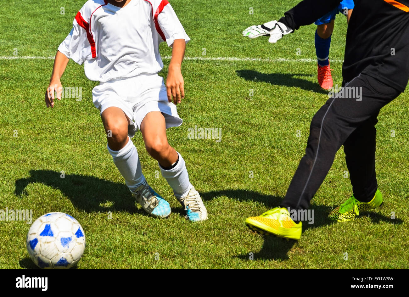 Young soccer players in action Stock Photo - Alamy