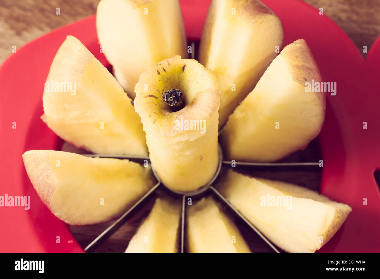 Apple cut into slices and core Stock Photo - Alamy