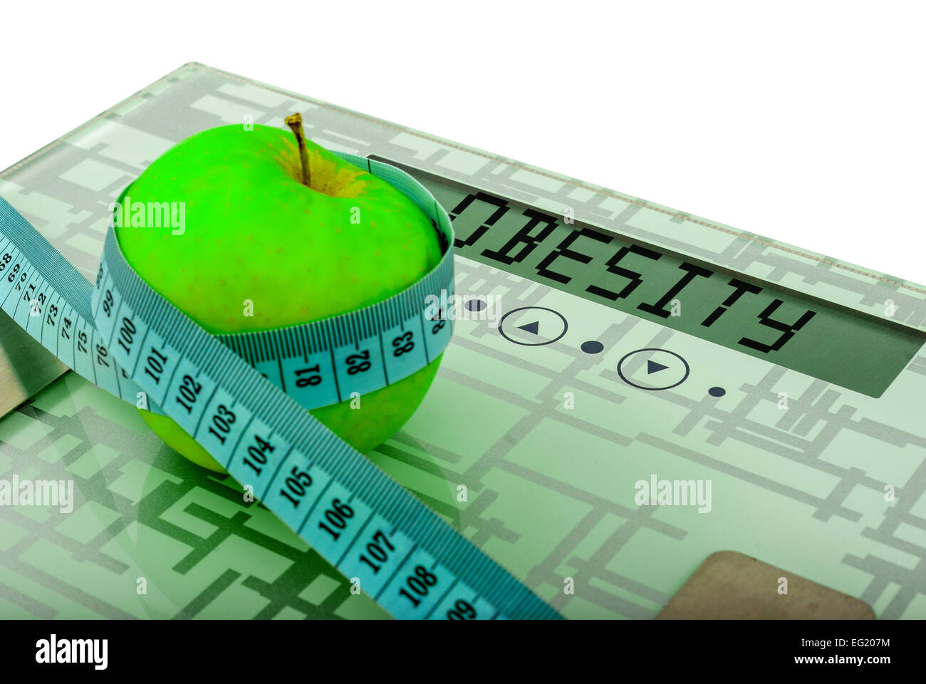 Apple and measure tape on weighing machine with sign obesity Stock ...