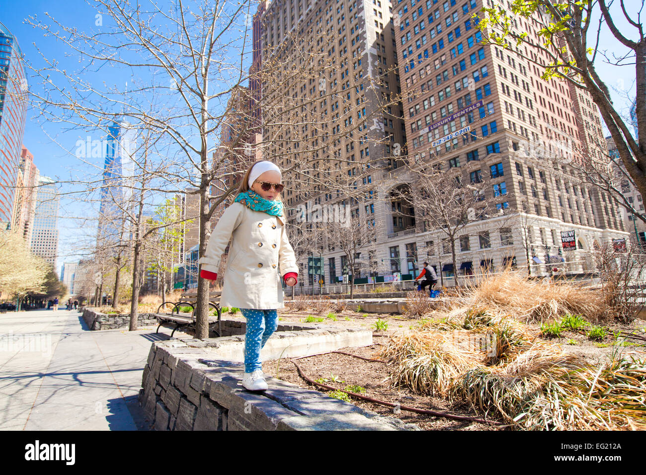 Adorable little girl walking in New York City at spring sunny day Stock ...