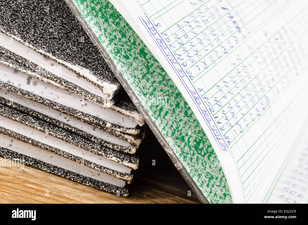 Old ledger books, the top one open and dislpaying handwriting Stock ...