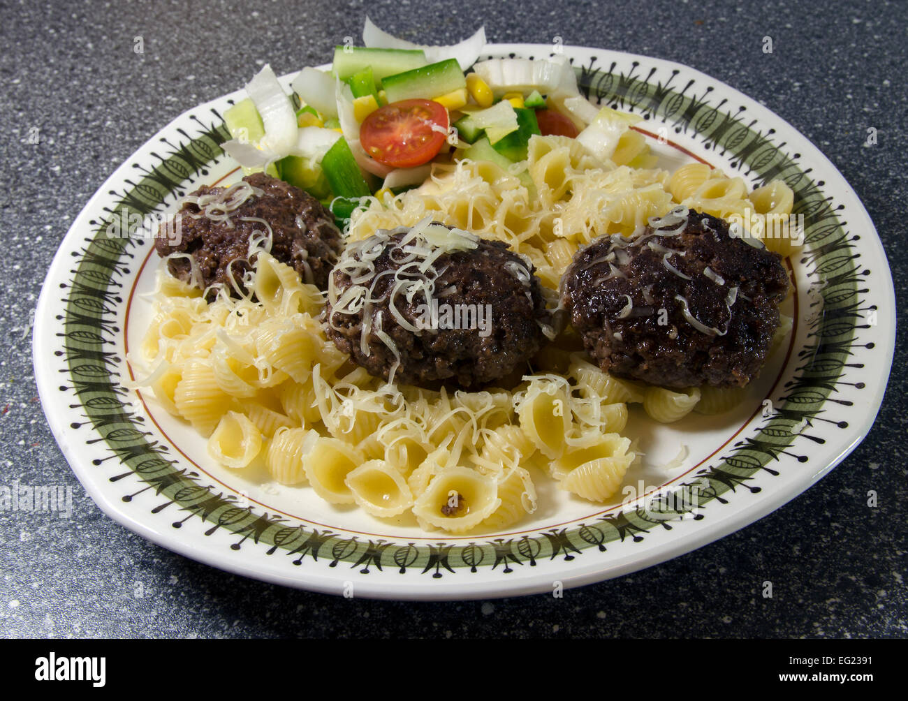 Beef of Moose meat and pasta with salad and on top cheese Stock Photo ...
