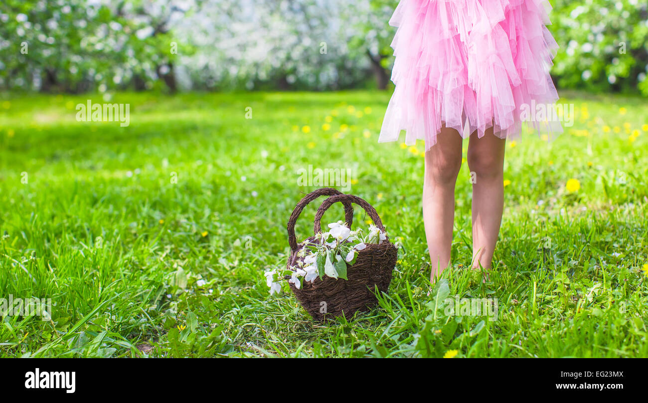 Adorable little girl in blossoming apple tree garden Stock Photo - Alamy