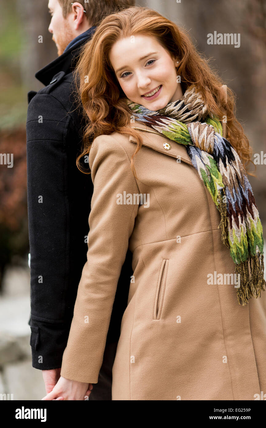 Young red hair couple at autumn park Stock Photo - Alamy