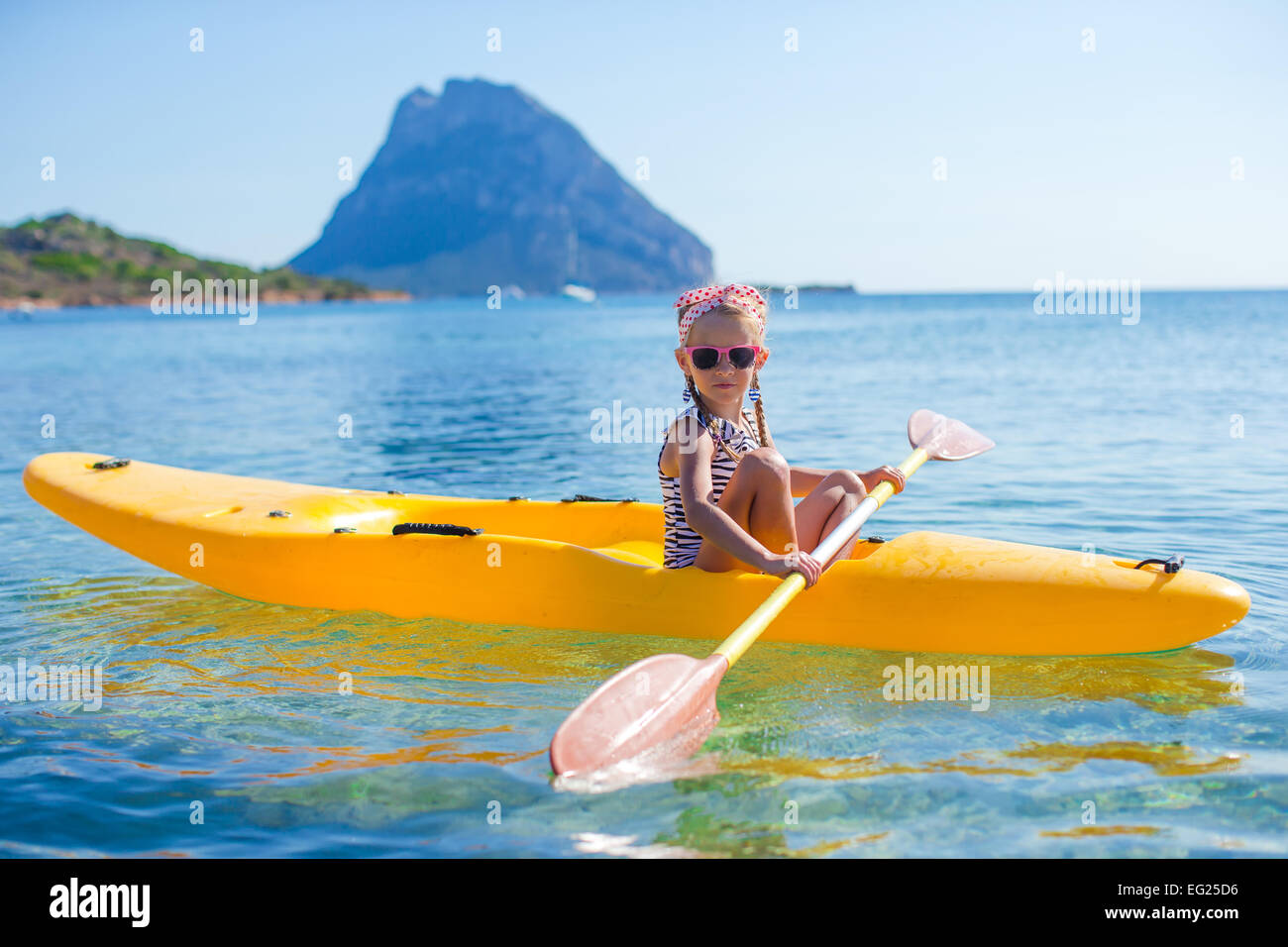 Adorable little girl kayaking during summer vacation Stock Photo - Alamy