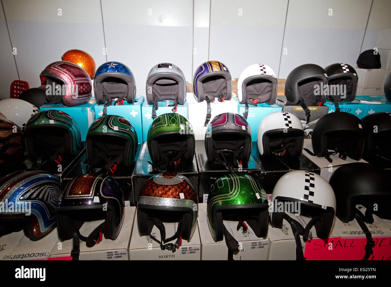 Colourful helmets for sale at the Carole Nash London Motorbike show at ...