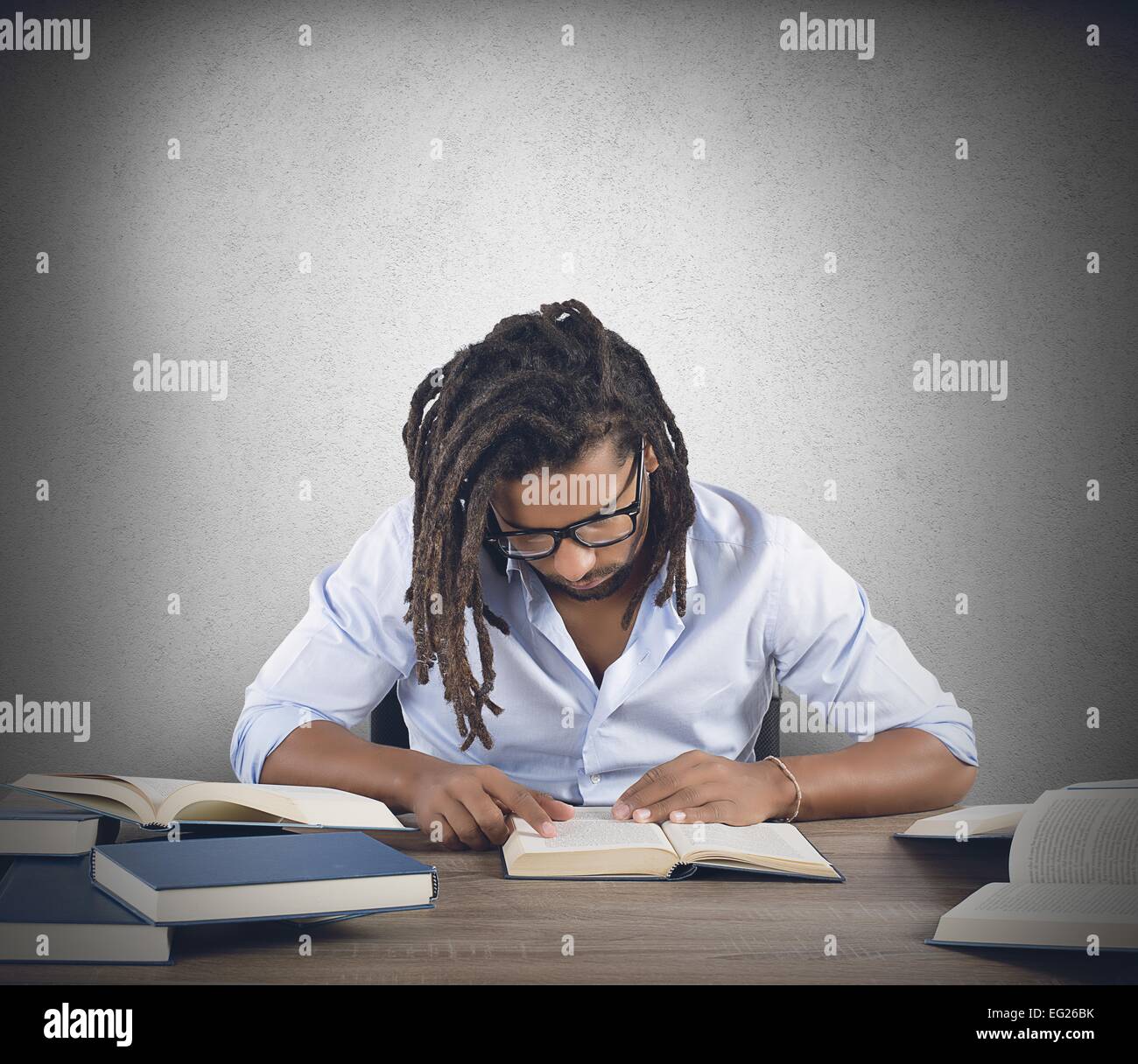 A concentrated man reads an interesting book Stock Photo - Alamy