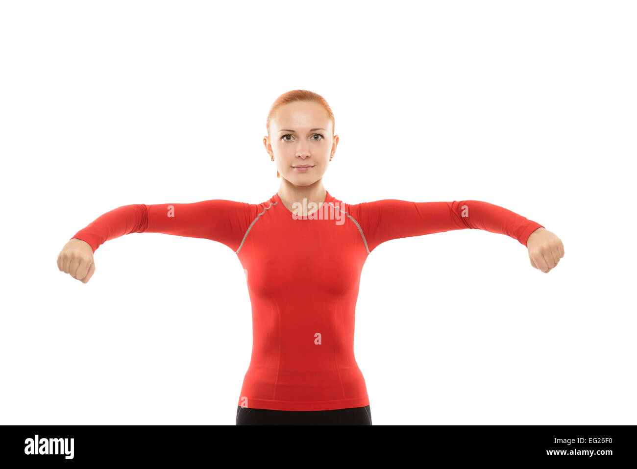 Beautiful young red woman performing fitness exercises over white ...