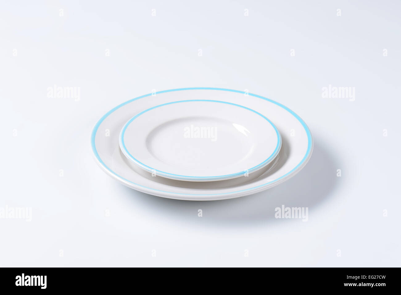 Dinner plate and side plate with blue colored edges Stock Photo - Alamy