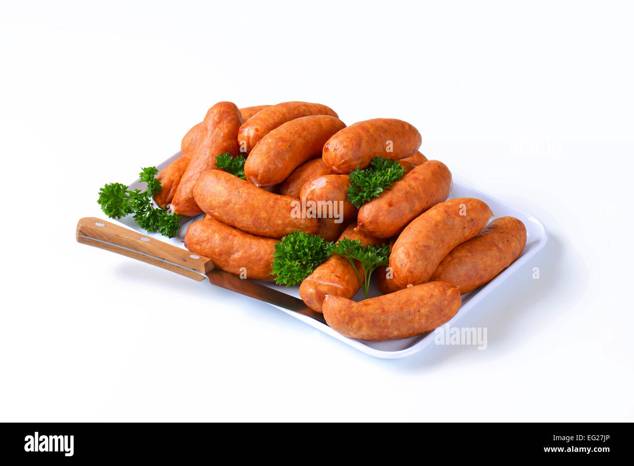 Pile of short kielbasa sausages on plate Stock Photo - Alamy