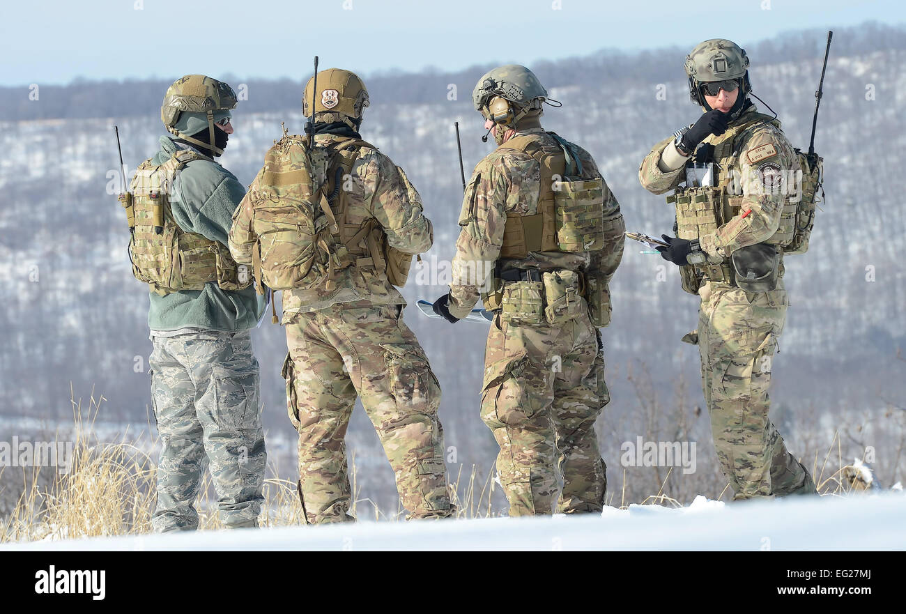Staff Sgt. Steven Stein right works with members of his joint terminal ...